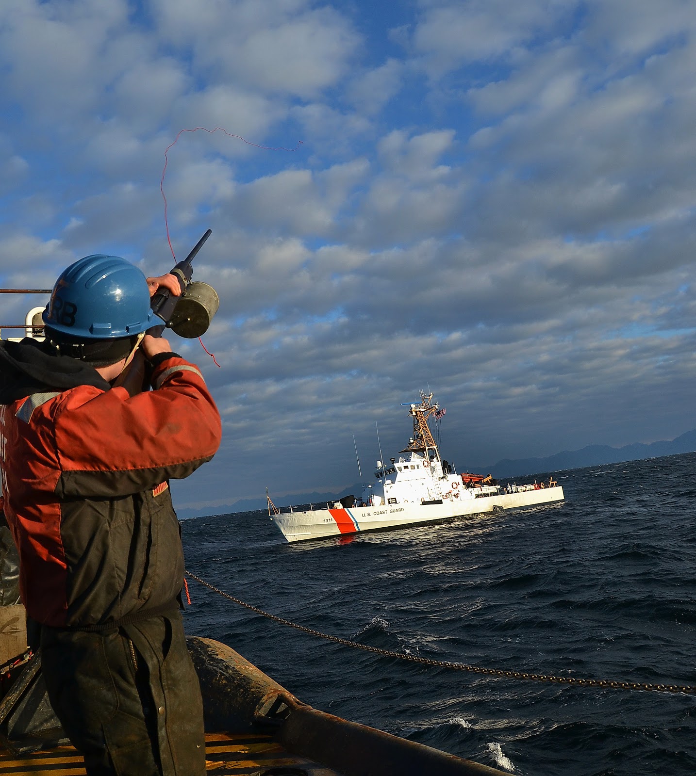 CGC Naushon Seaman Ronald Benke, aboard Coast Guard Cutter SPAR, shoots ...