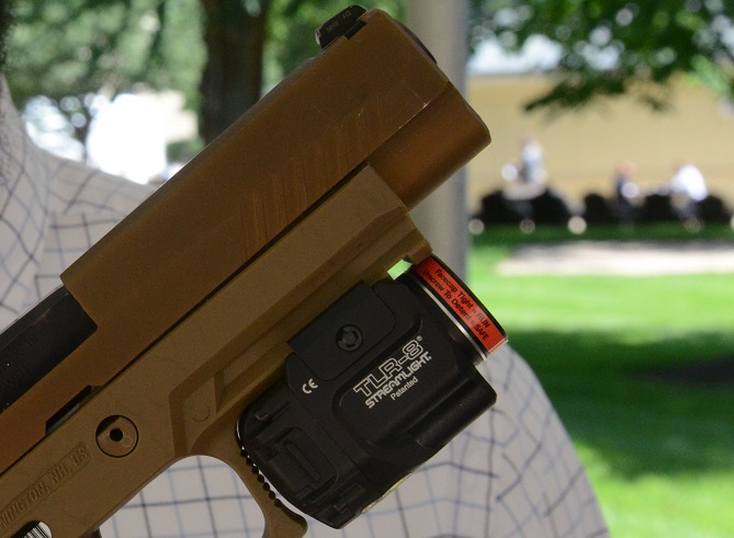 Multifunction Aiming Light, mounted on the rails of a Modular Handgun ...