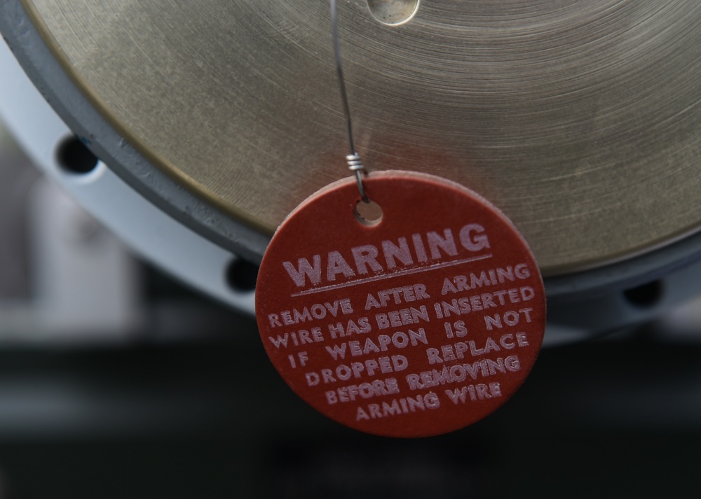 warning tag is displayed on an inert Mark 62 Quickstrike mine firing ...