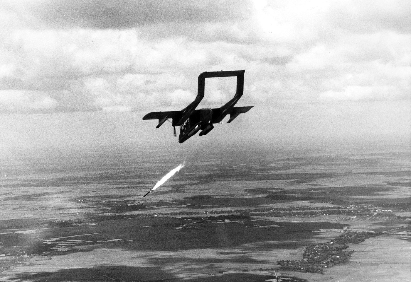 OV-10 A firing a 5inch Zuni rocket. 5 and 2.75inch rocket pods under ...