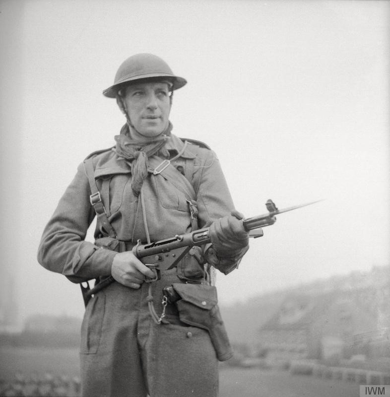 soldier demonstrates the new bayonet for the Sten gun, 3 August 1942 ...