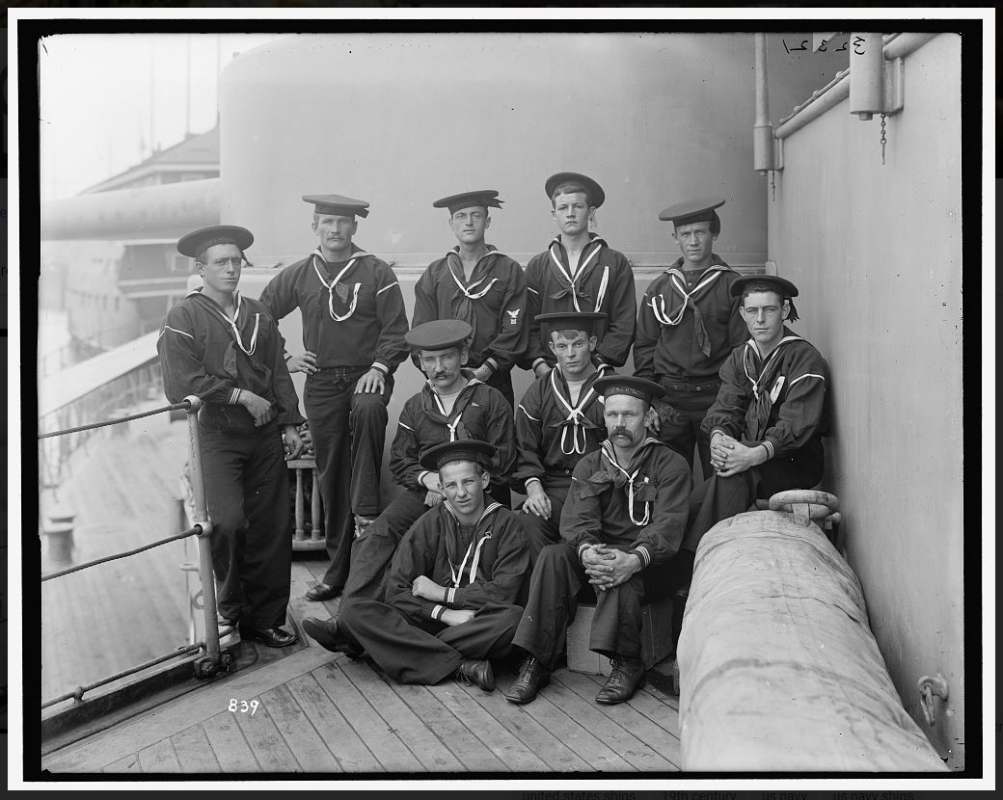 Gunners Mate First Class (Gun Captain) George Sanderson in the center ...