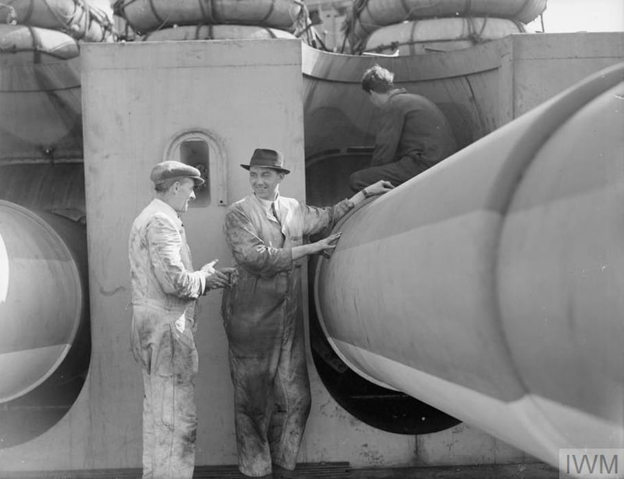 HMS Howe Aug 1942 Men from Vickers-Armstrong at work on the big guns ...