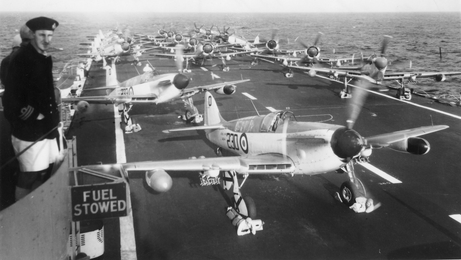 Firefly F.R.5s of 810 squadron ranged on deck , engines running ready ...