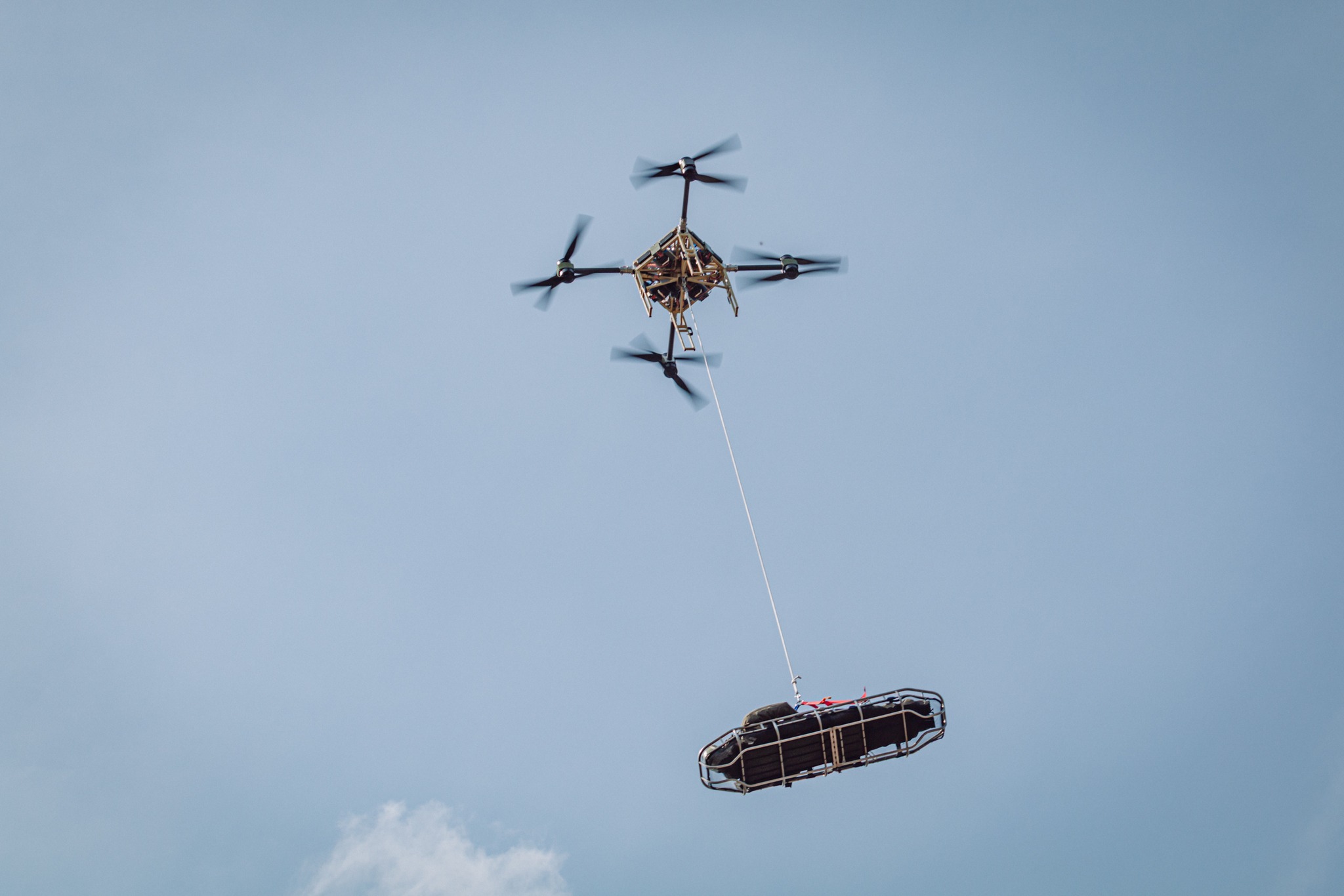 UAV with a stokes litter slung underneath for casevac Polish Army ...