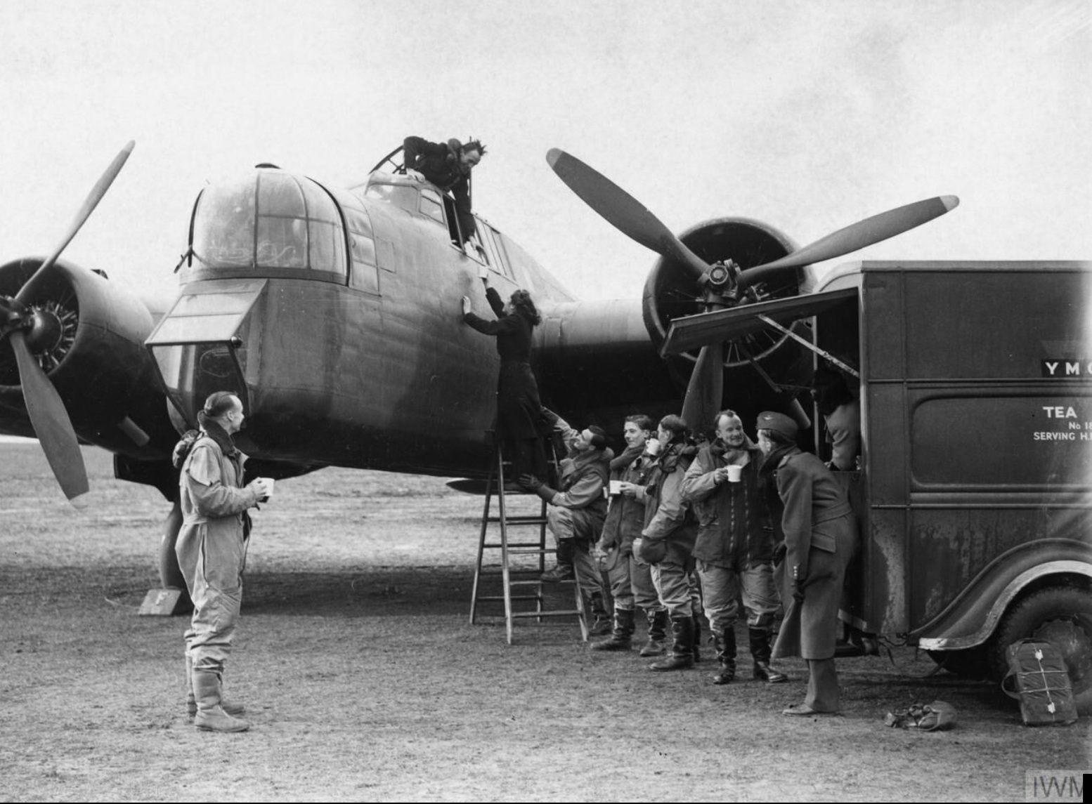 Armstrong Whitworth Whitley Mk III and crew, with YMCA tea car in ...